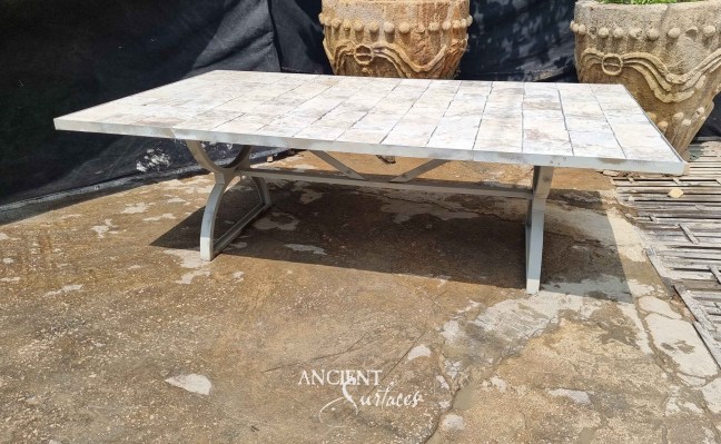 The Unique Allure of Reclaimed Stone Tables Offered by Ancient Surfaces